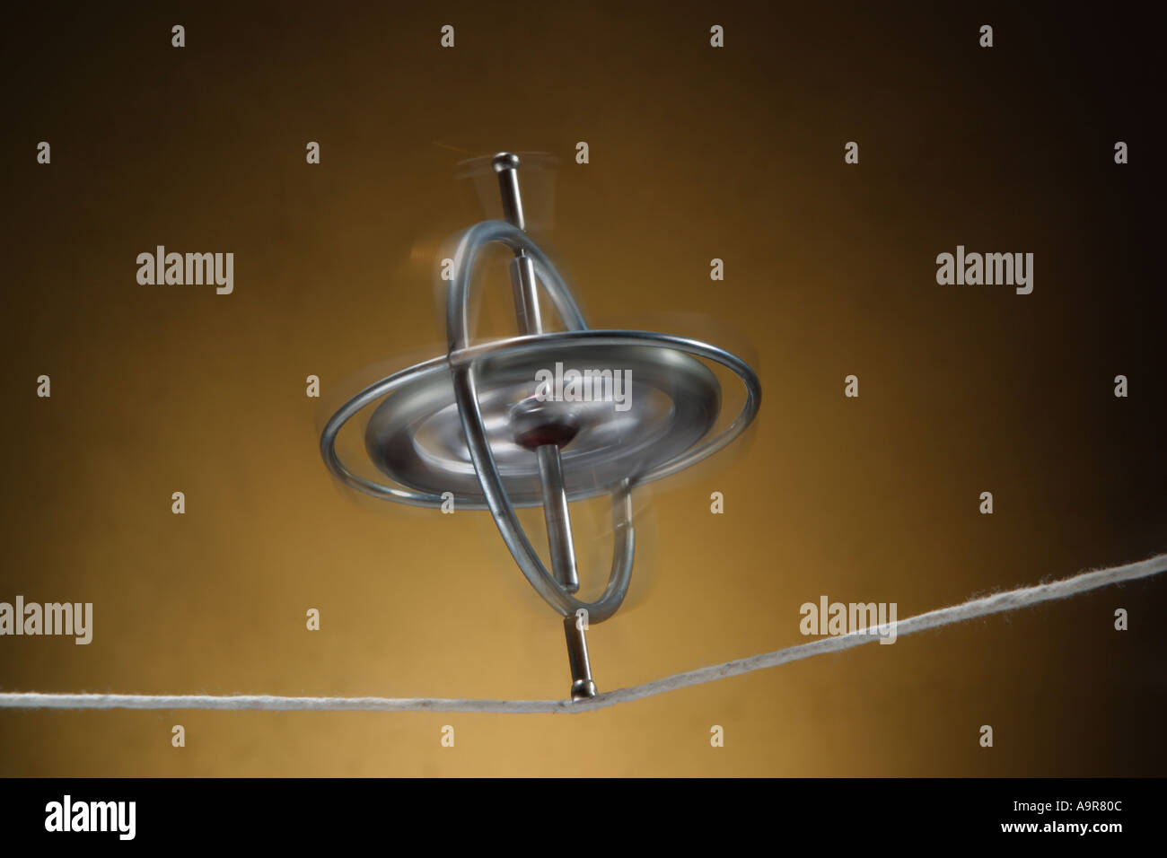 Gyroscope balancing on string hi-res stock photography and images - Alamy