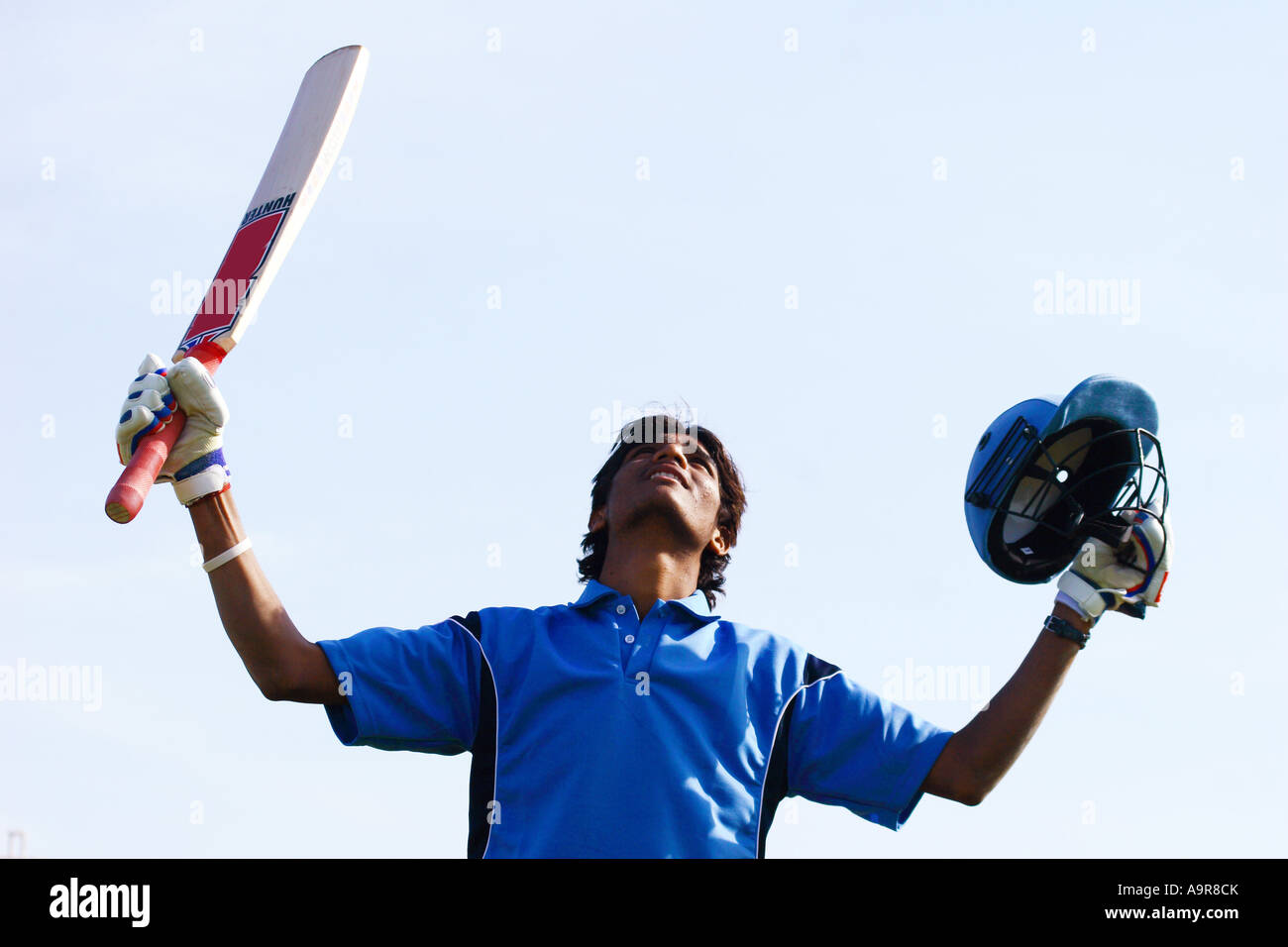 Cricket batsman raising bat hi-res stock photography and images - Alamy
