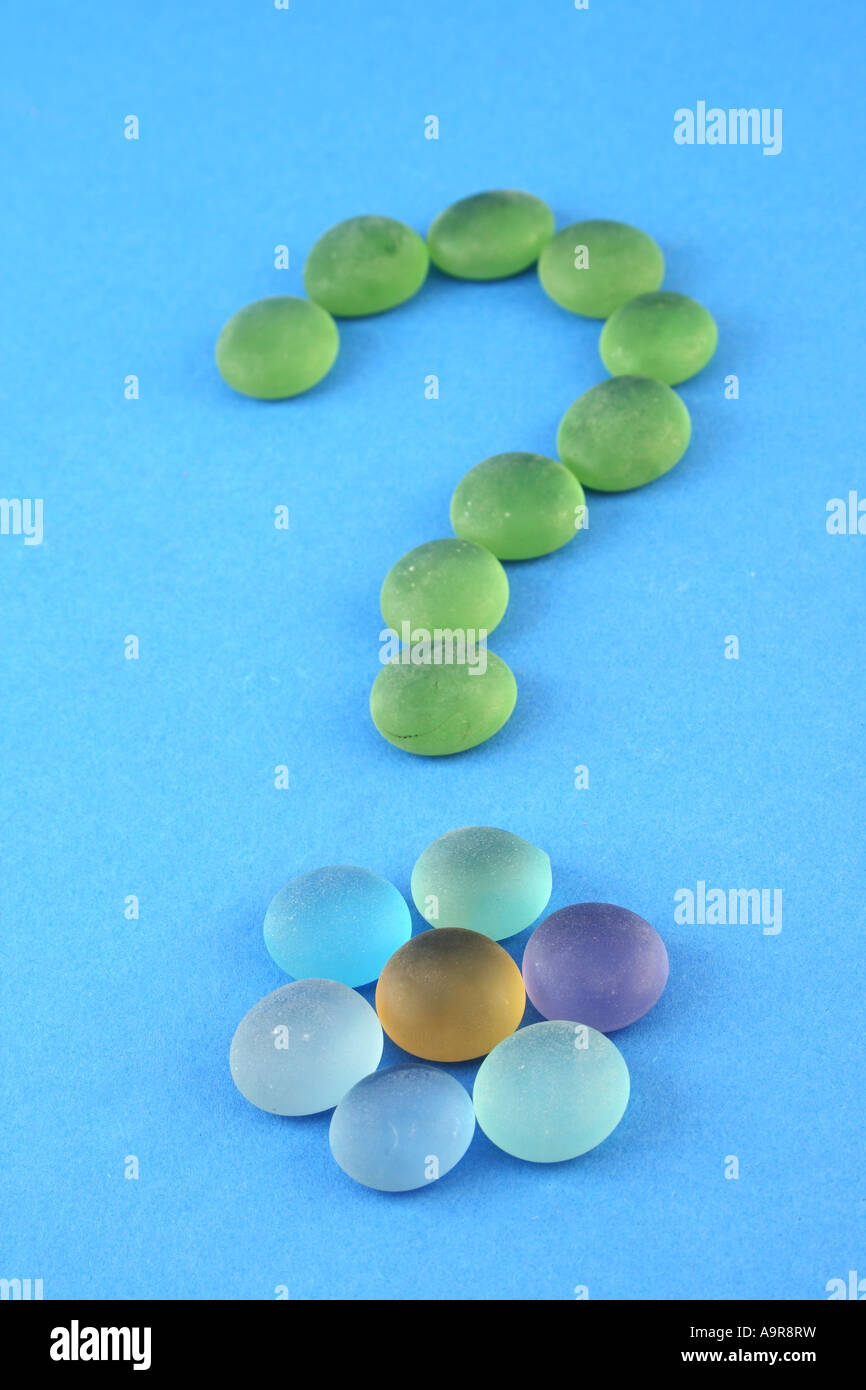 Formation of question mark sign with smooth colourfu stones Stock Photo ...