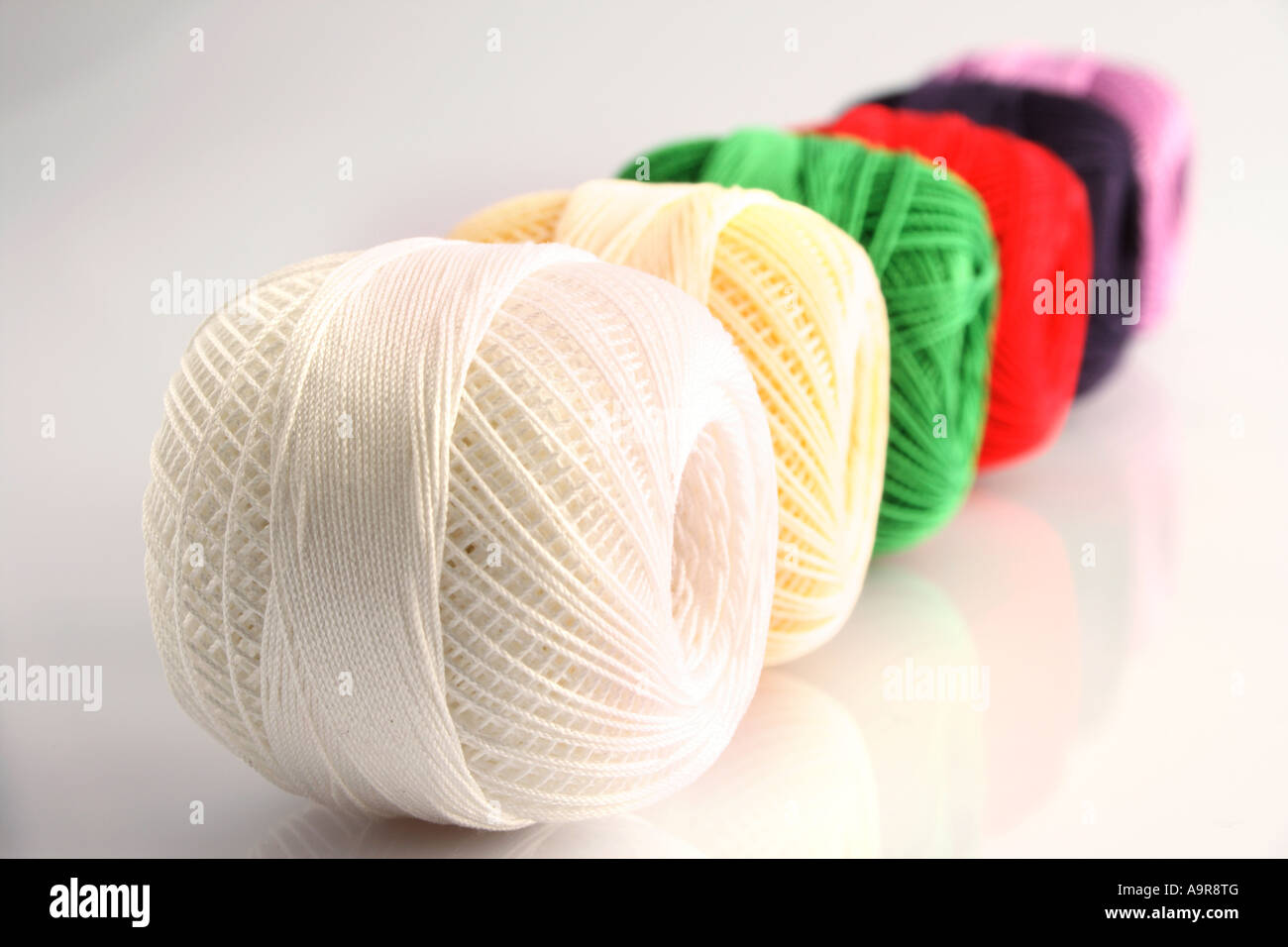 Spools of thread in a row Stock Photo - Alamy