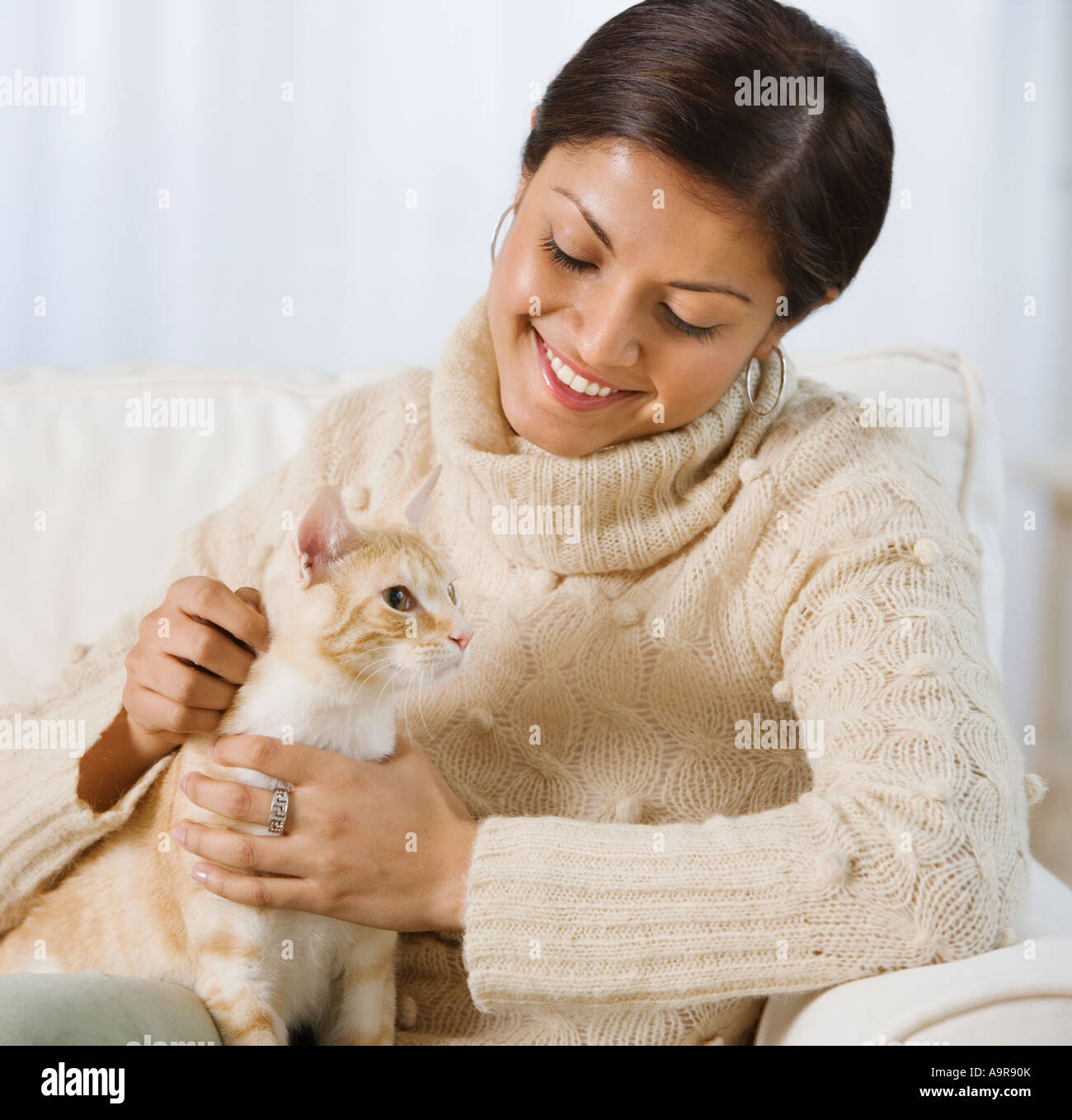 Indian woman holding cat hi-res stock photography and images - Alamy