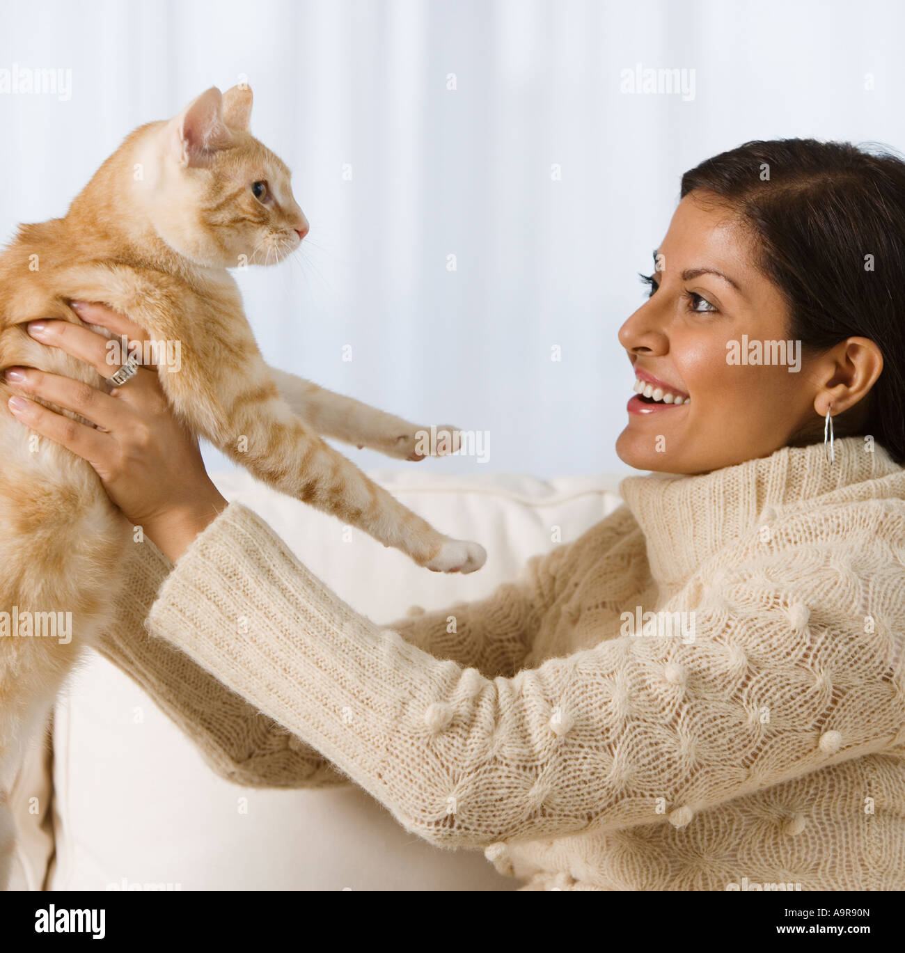 Indian woman holding cat Stock Photo - Alamy