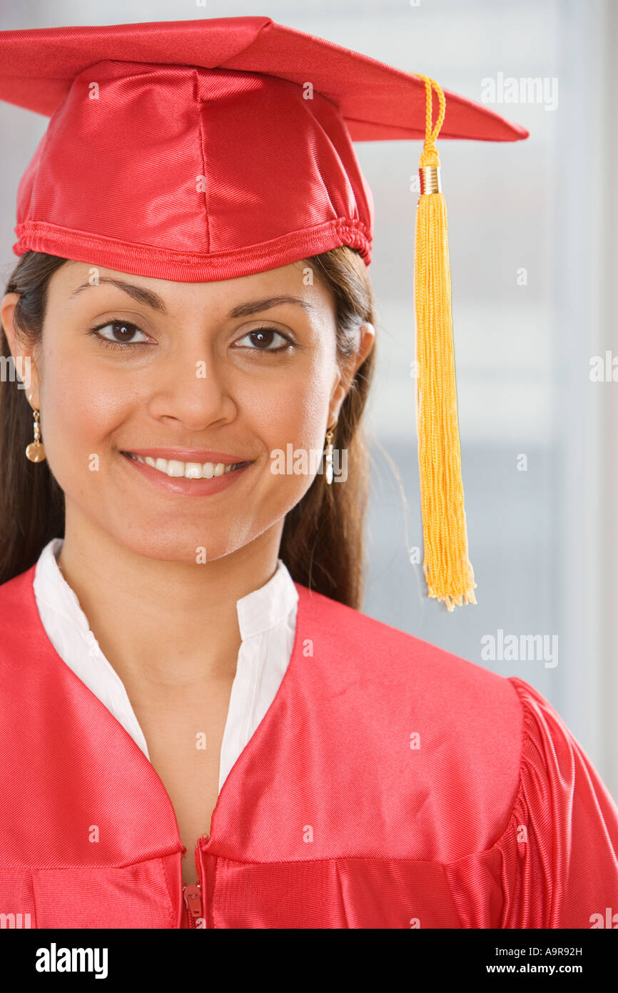 Indian woman wearing graduation cap and gown Stock Photo - Alamy