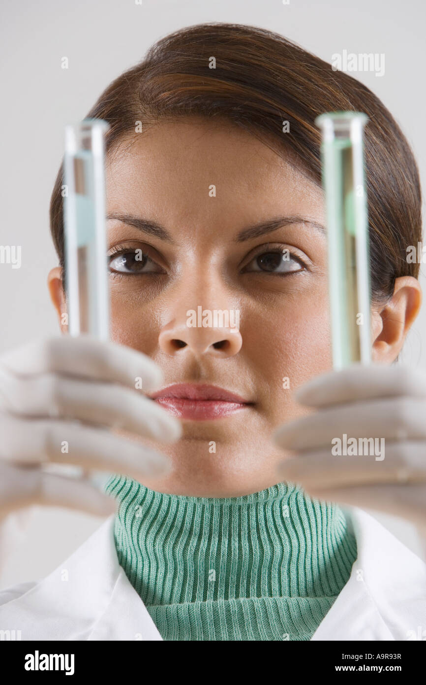 Indian female scientist looking at vials Stock Photo - Alamy