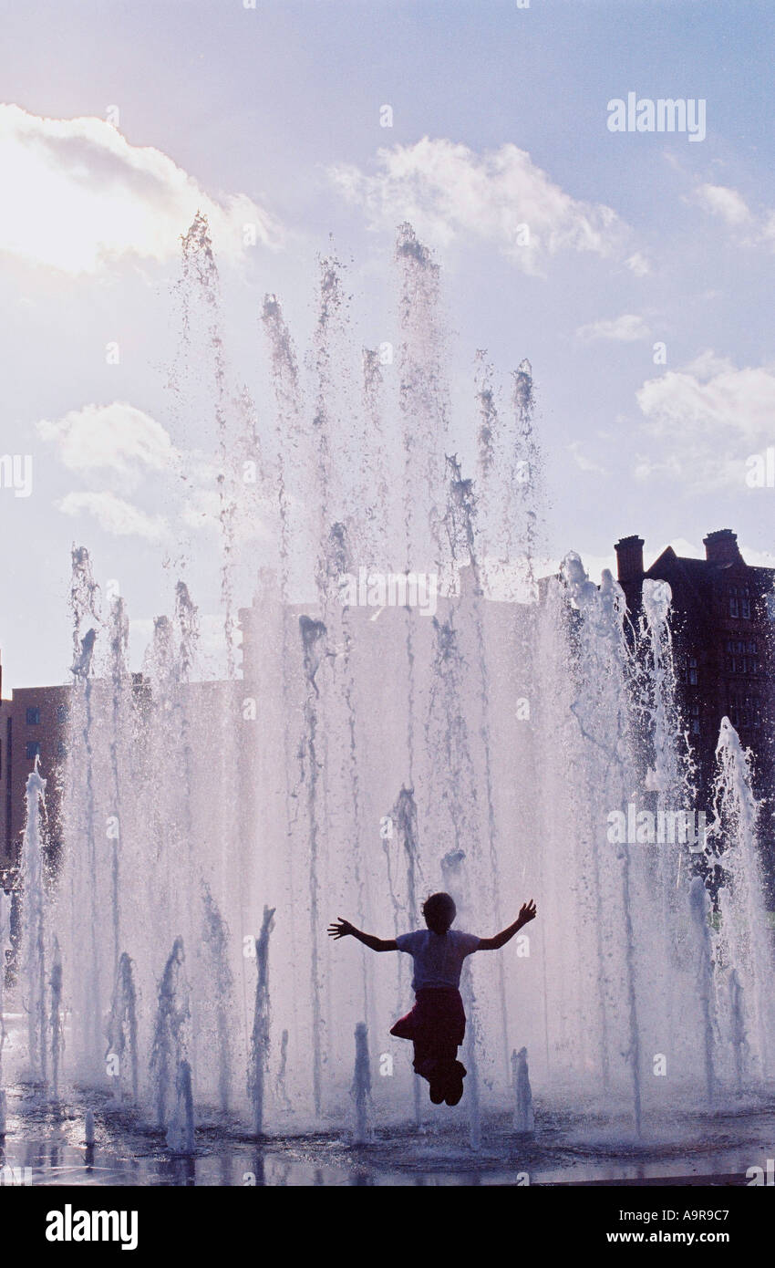 Child fountain jump hi-res stock photography and images - Alamy