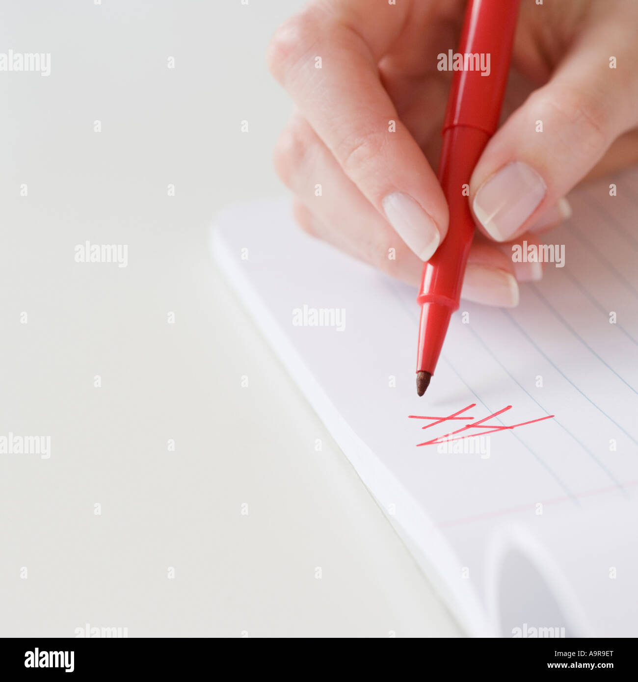 Female teacher marking homework hi-res stock photography and images - Alamy