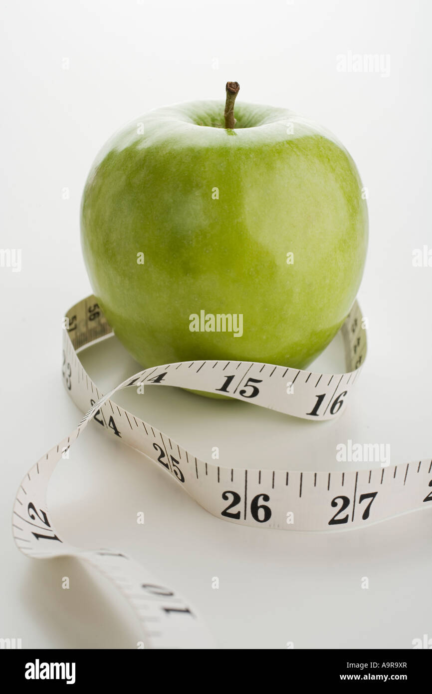 Apple and tape measure Stock Photo - Alamy