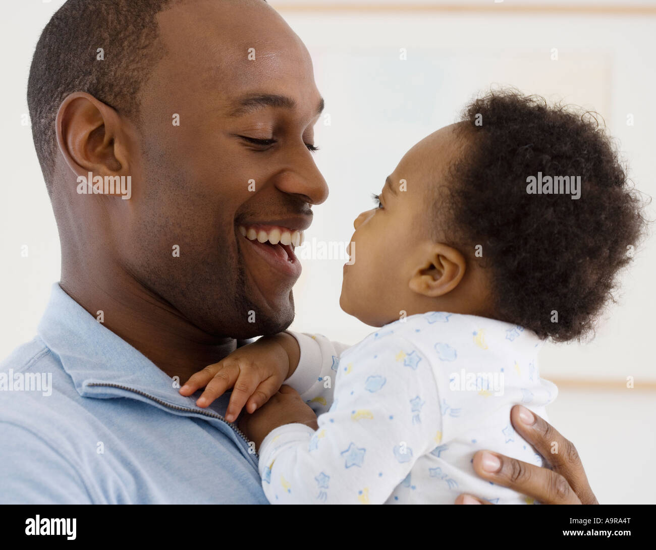 Side view father supporting boy hi-res stock photography and images - Alamy