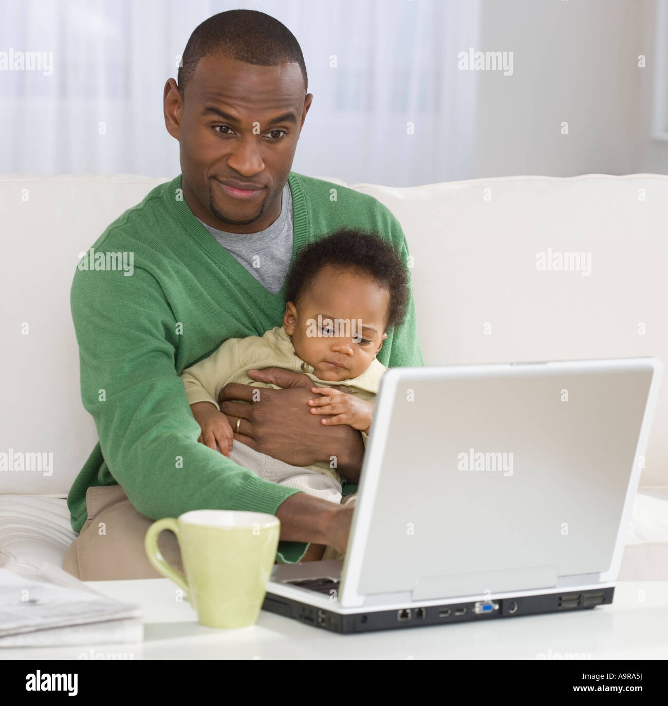 Boy Sitting At Computer Typing Stock Photos & Boy Sitting At Computer ...
