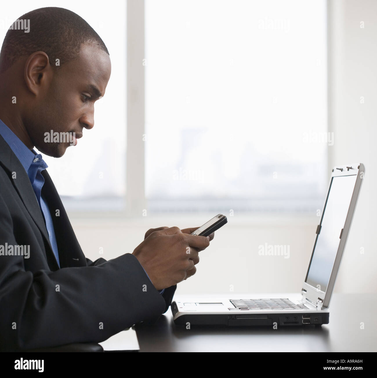 African businessman dialing cell hi-res stock photography and images ...
