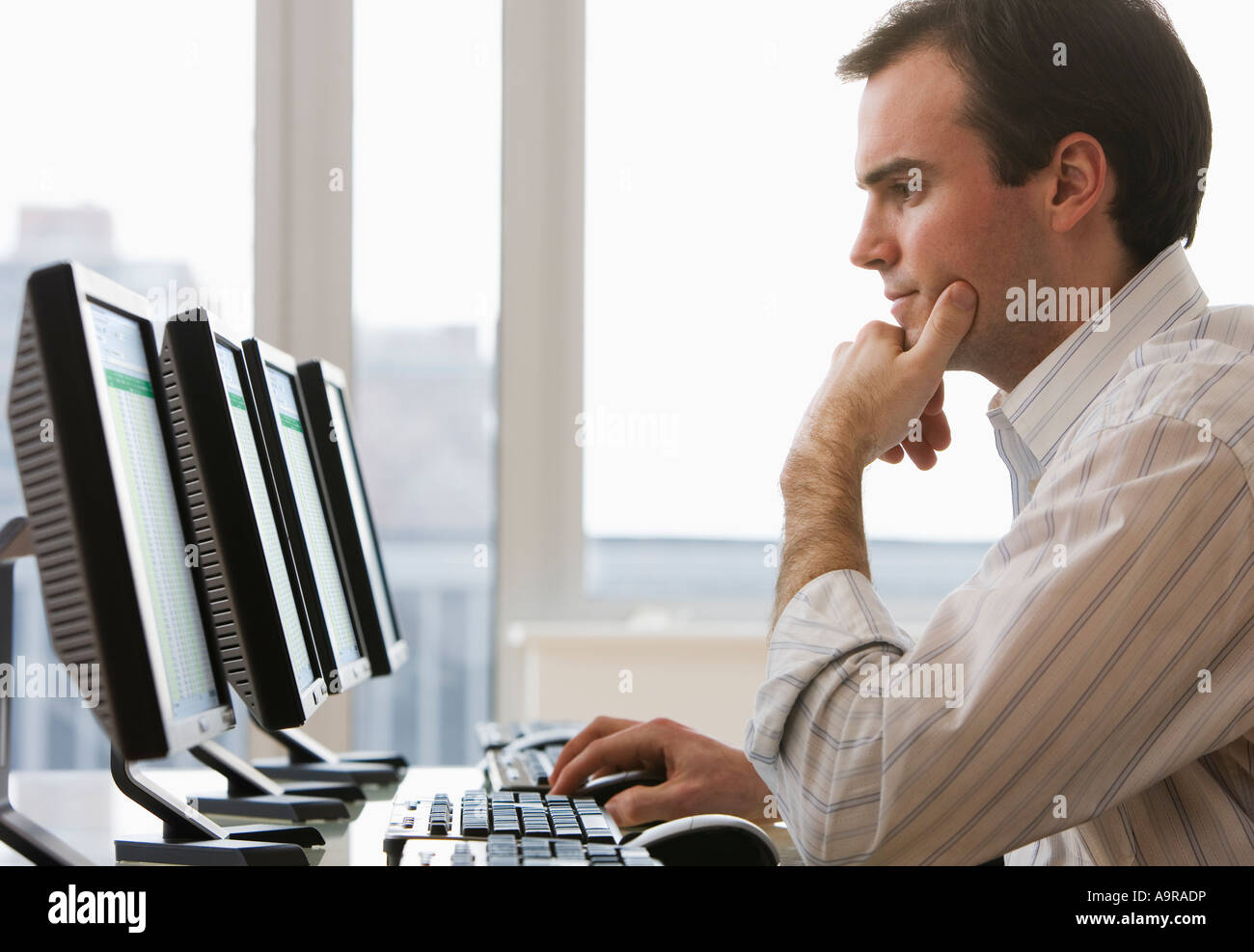Businessman typing on computer Stock Photo - Alamy