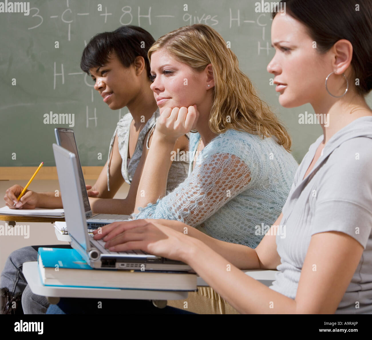 Multi ethnic women in classroom Stock Photo - Alamy