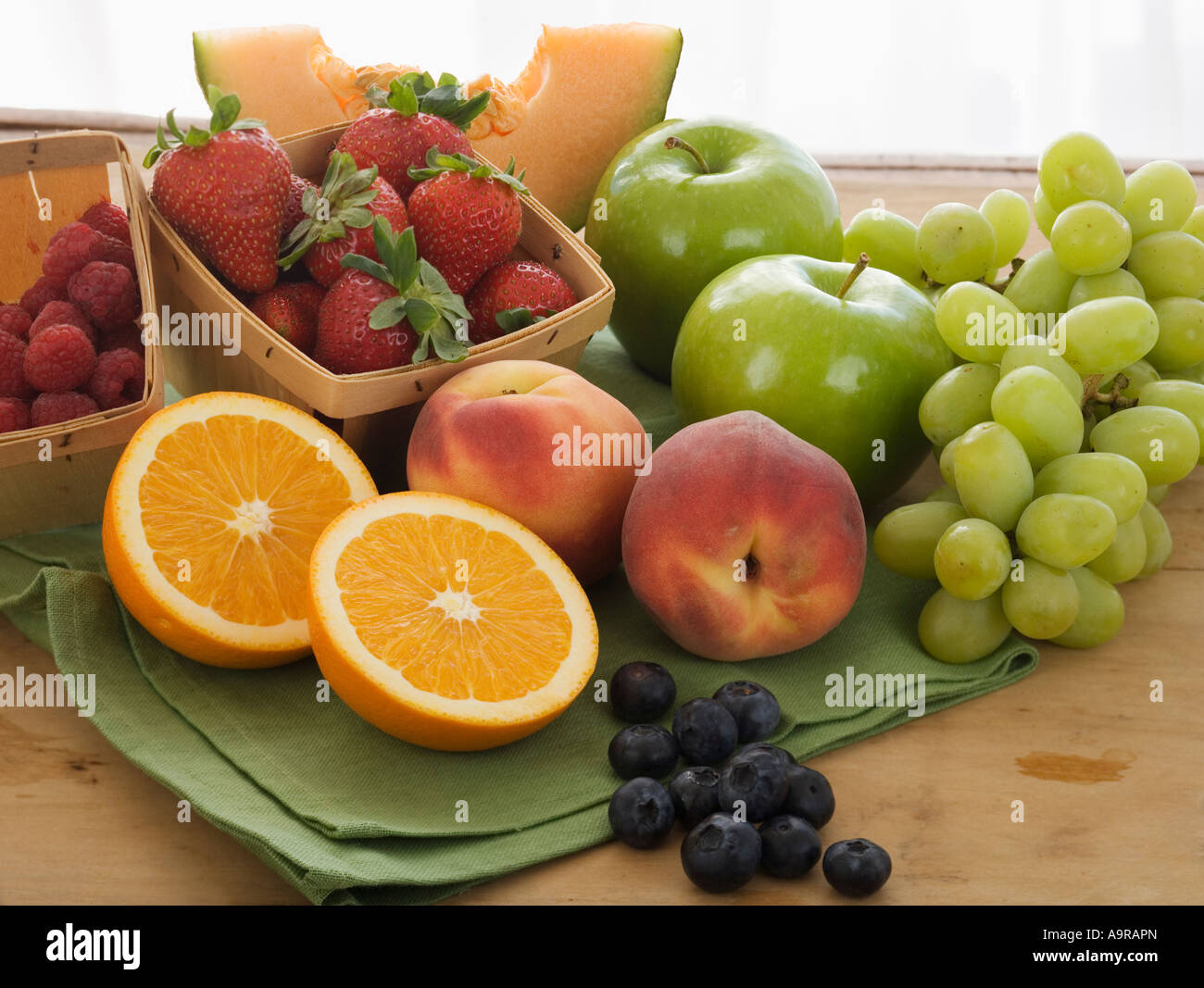 Assorted fruit on table Stock Photo - Alamy