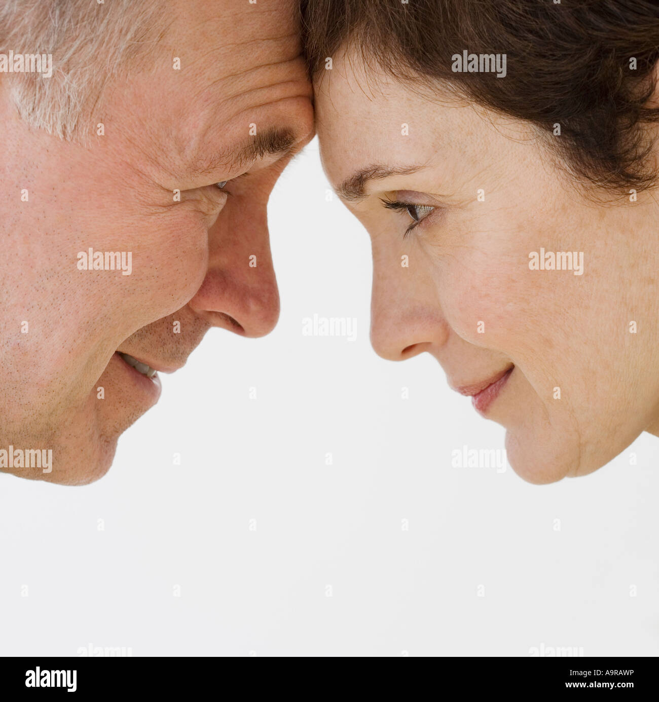 Close up of couple touching foreheads Stock Photo - Alamy