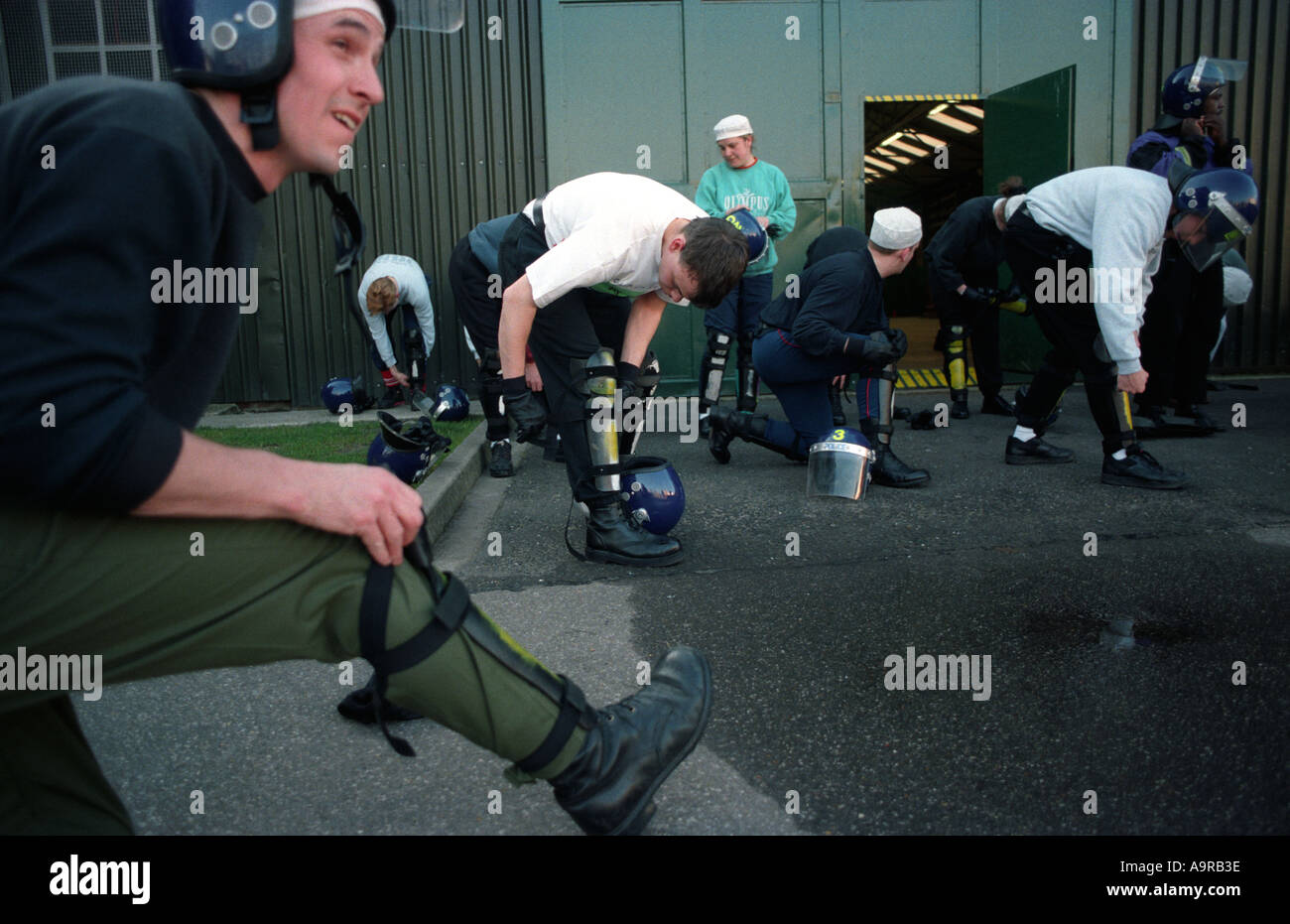 Metropolitan police officers put on their protective kit in preparation ...