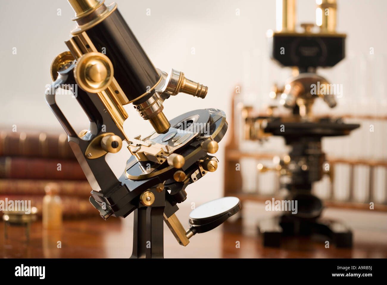 Old fashioned microscopes on table Stock Photo - Alamy