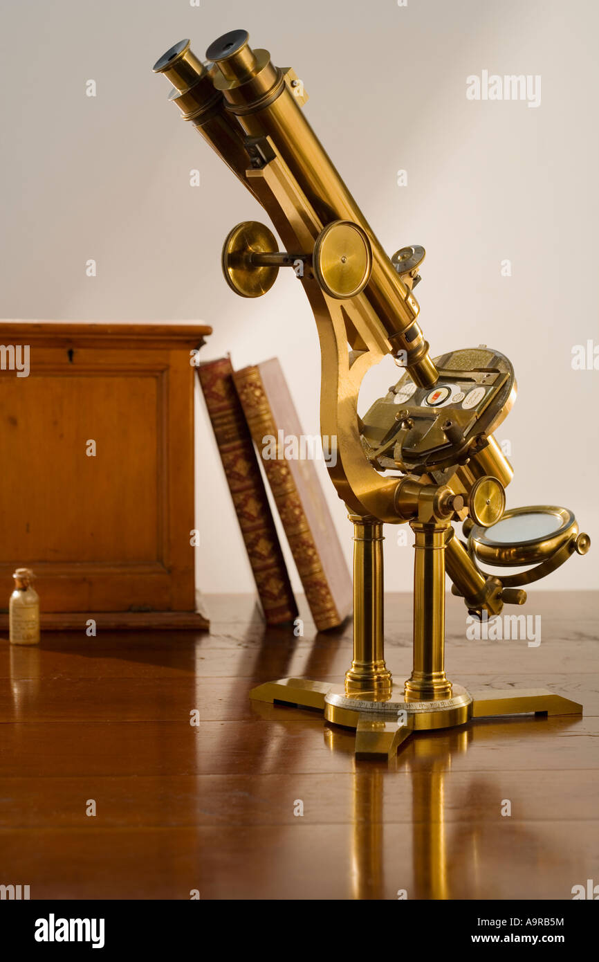 Old fashioned microscope on table Stock Photo - Alamy