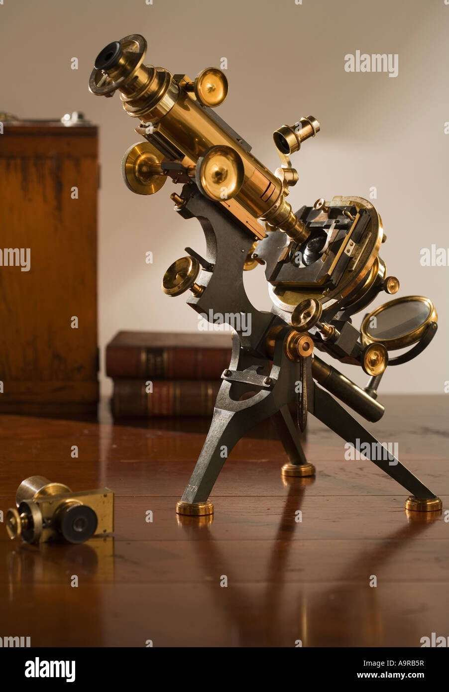 Old fashioned microscope on table Stock Photo - Alamy