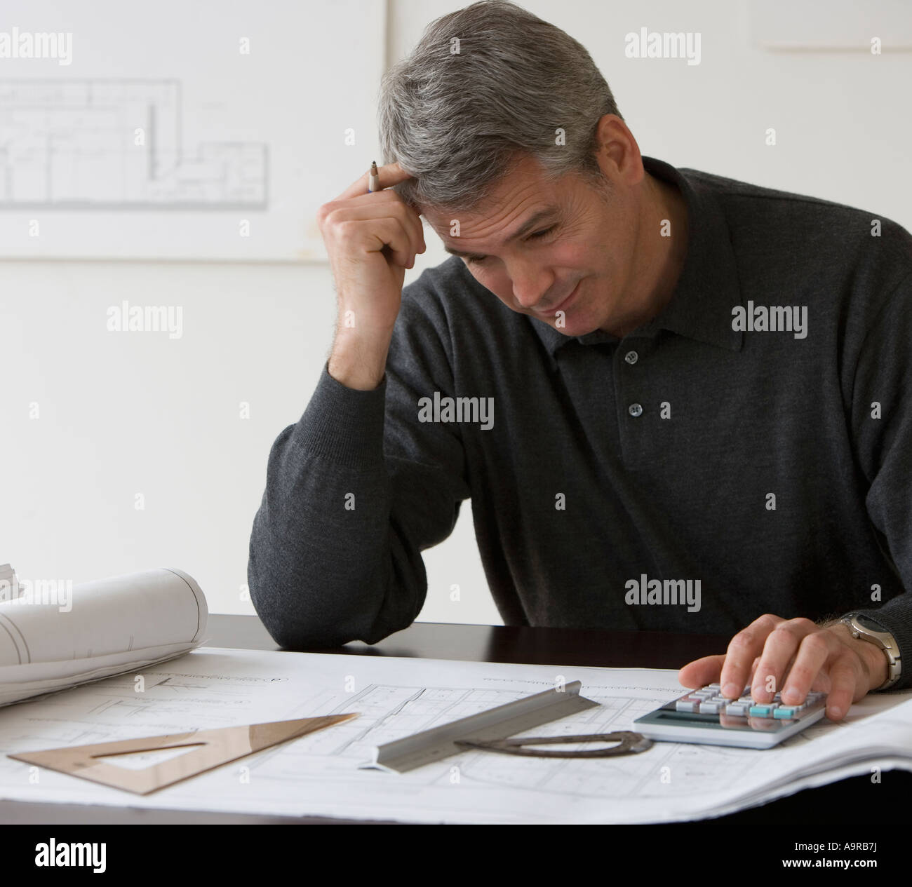 Male architect working at desk Stock Photo - Alamy