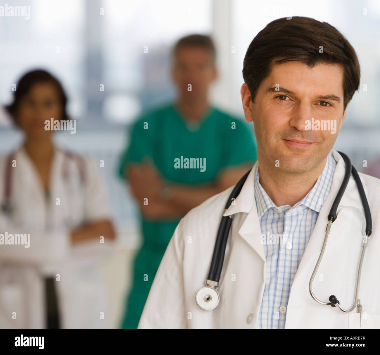 Male doctor wearing stethoscope Stock Photo - Alamy
