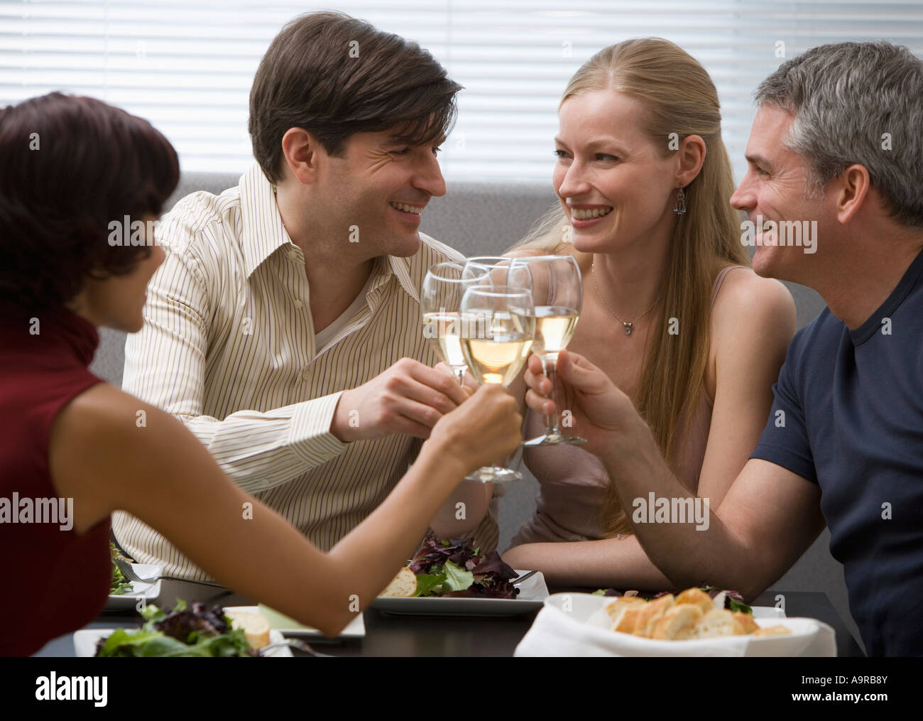 Two mature couples dinner hi-res stock photography and images - Alamy