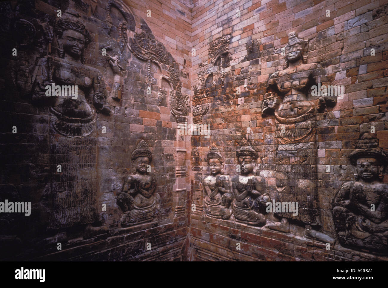 Bas relief carvings in brick in the 10th century Khmer temple of Prasat ...