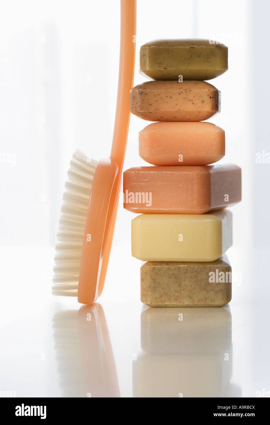 Stack of bar soap and brush Stock Photo - Alamy