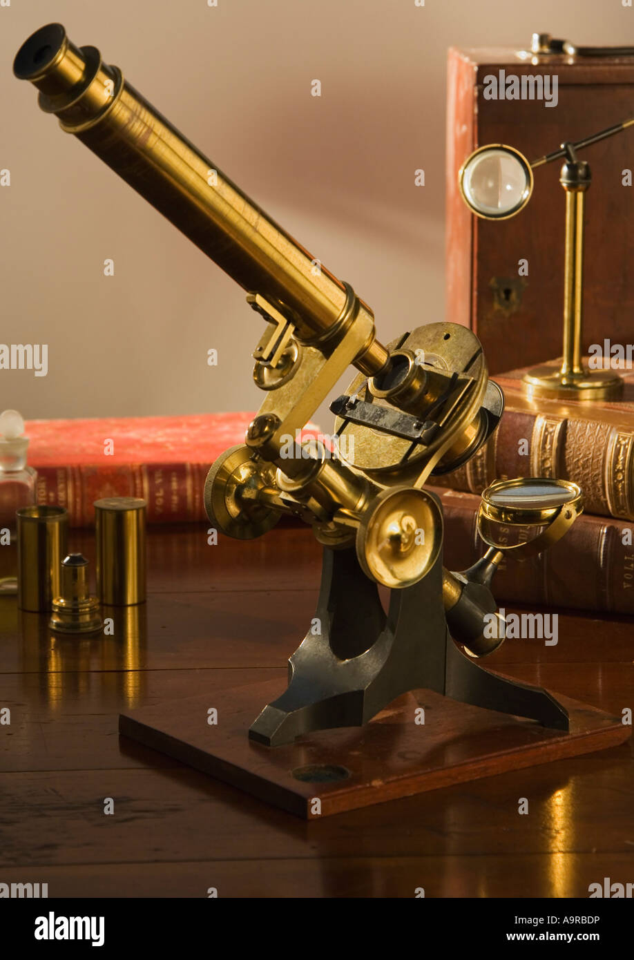 Old fashioned microscope on table Stock Photo - Alamy