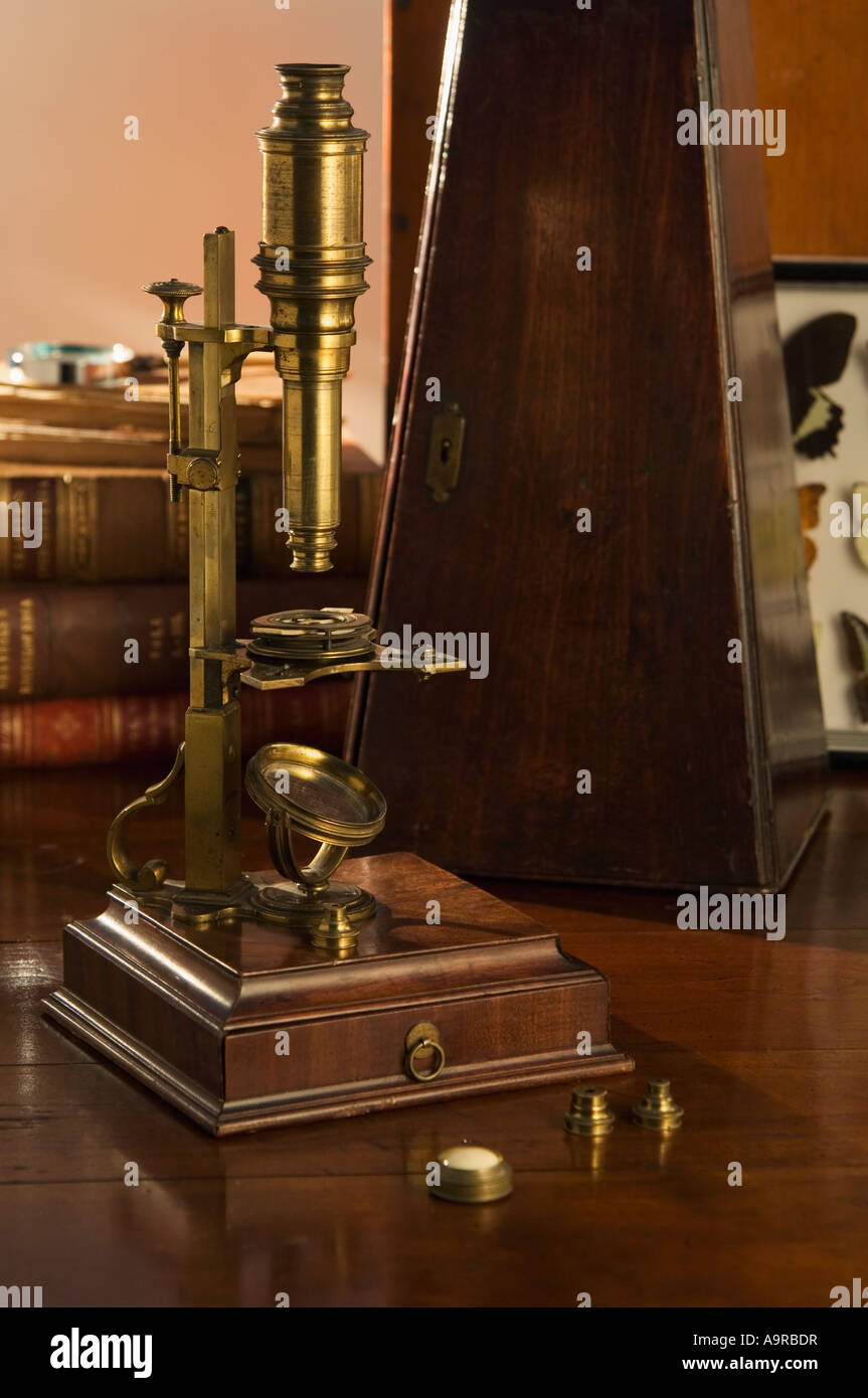 Old fashioned microscope on table Stock Photo - Alamy