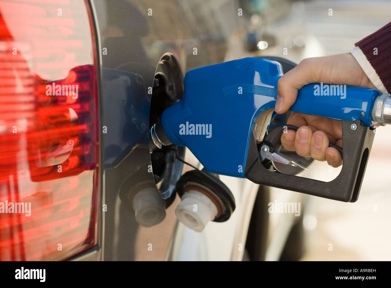 Man pumping gas Stock Photo - Alamy