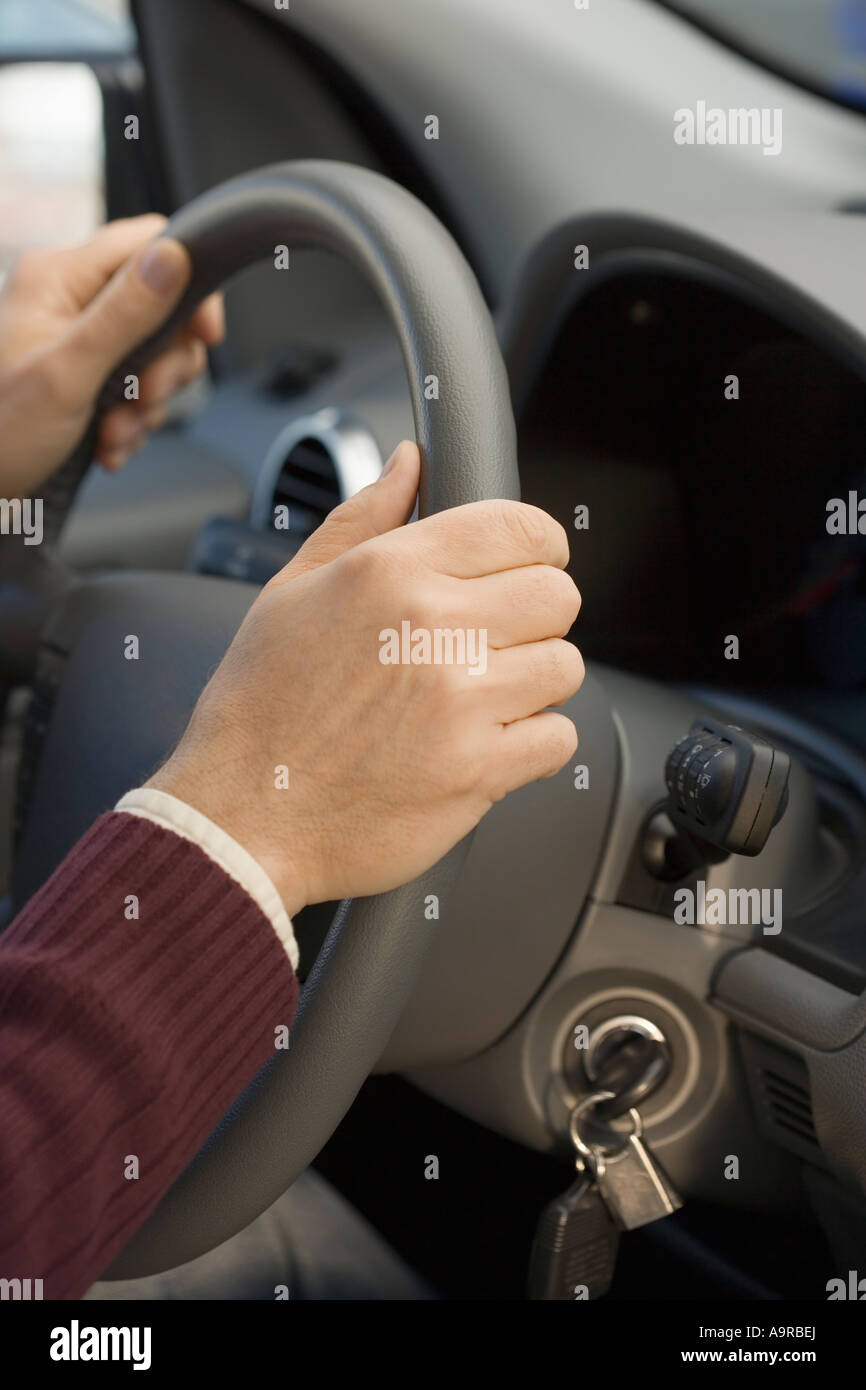 Man s hands on steering wheel Stock Photo - Alamy