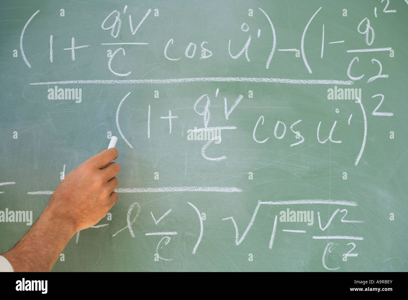 Professor writing formulae on blackboard Stock Photo - Alamy
