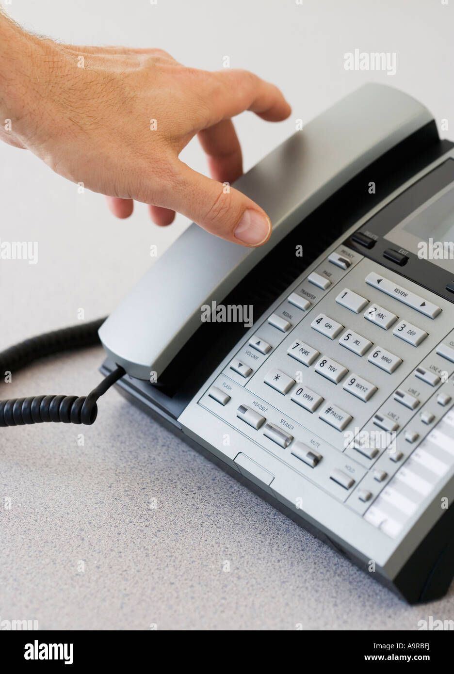 Man reaching for telephone receiver Stock Photo - Alamy