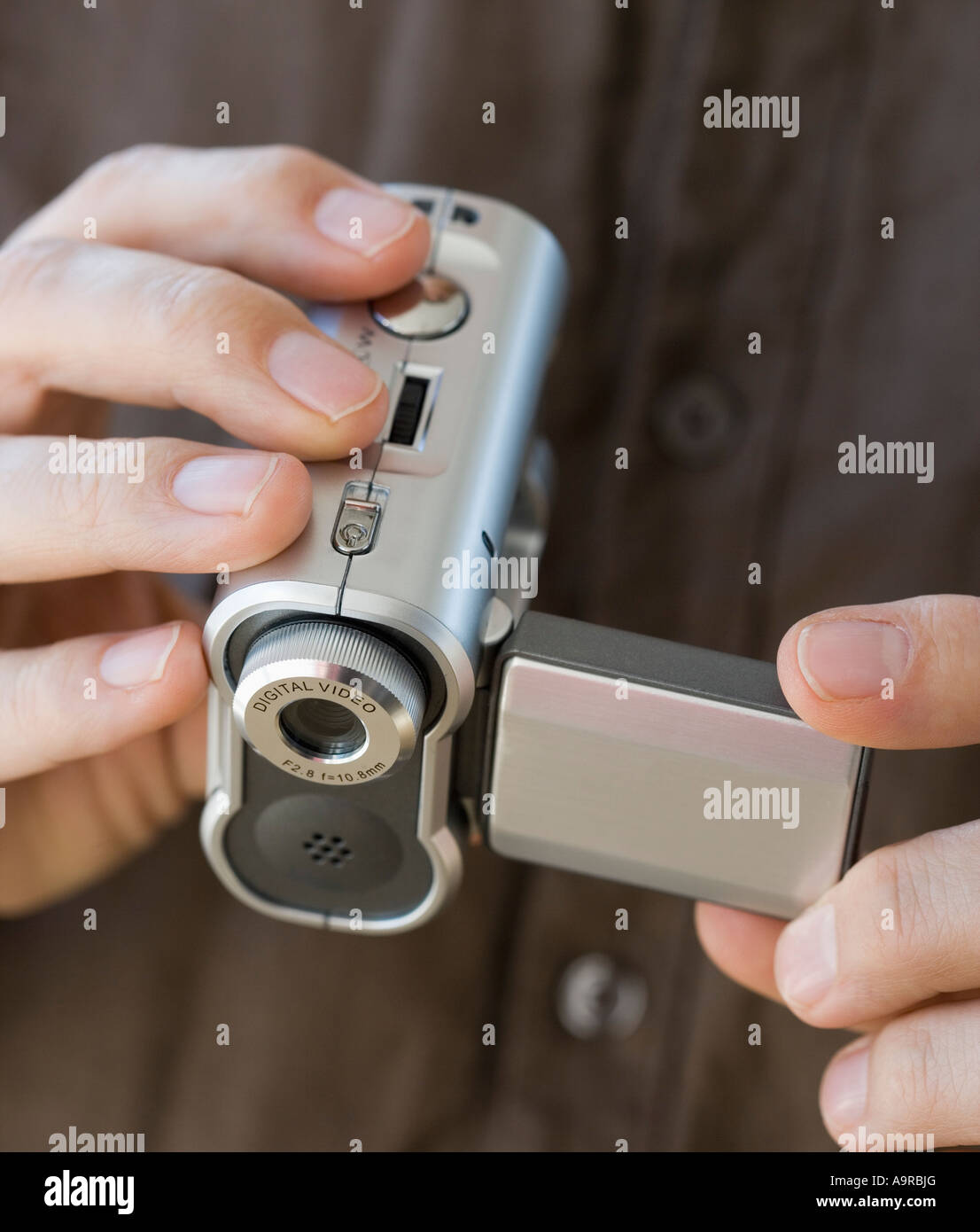 Man holding video camera Stock Photo - Alamy