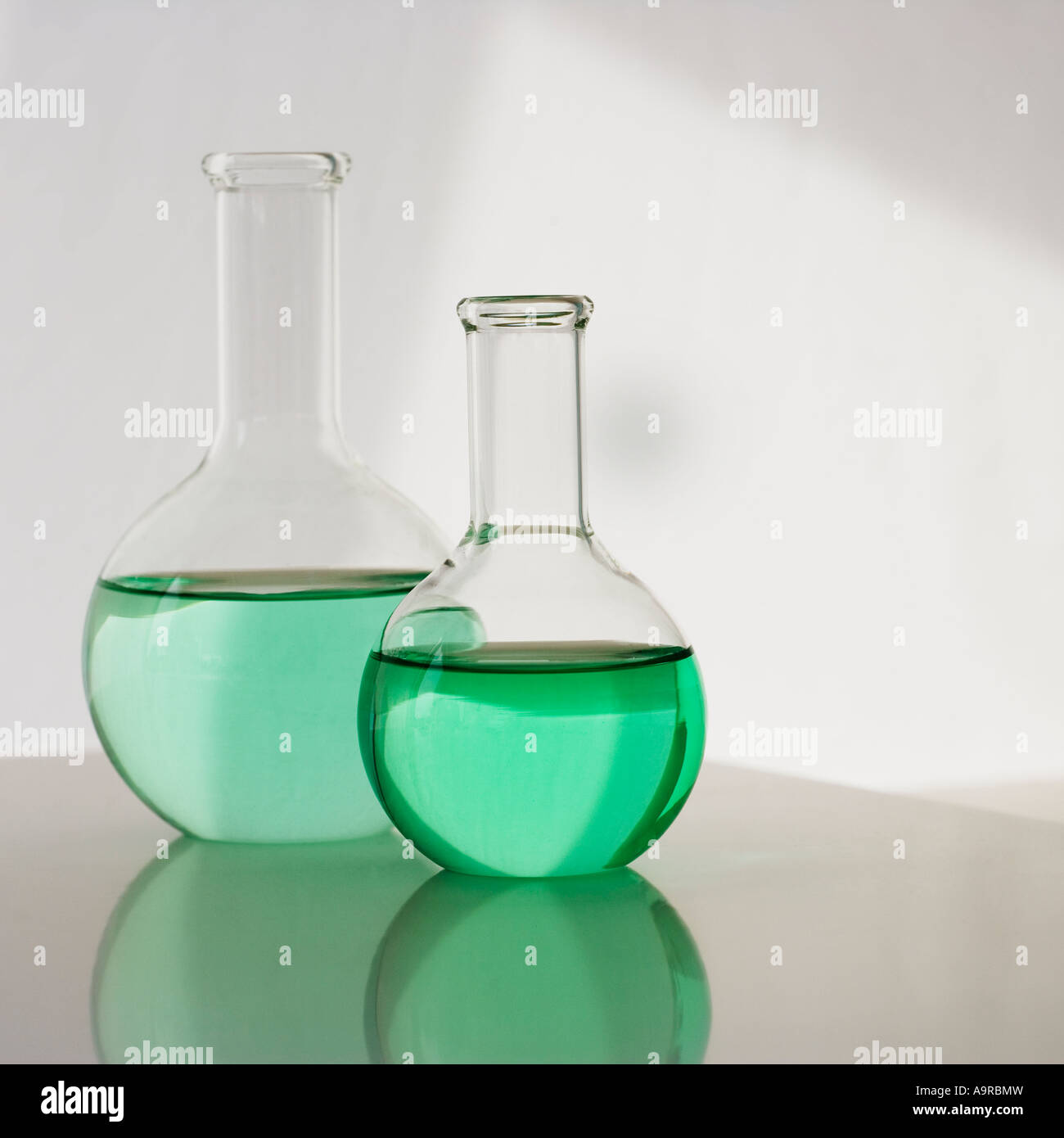 Two beakers with liquid Stock Photo - Alamy