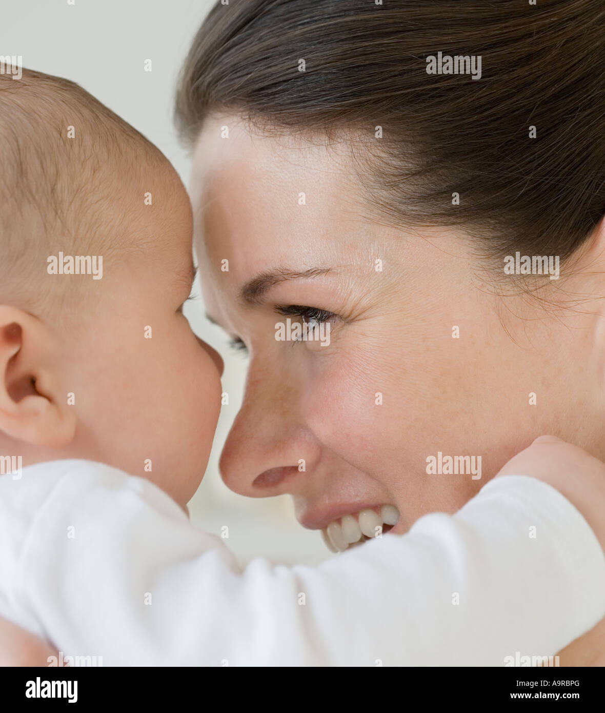 Mother smiling at baby Stock Photo - Alamy
