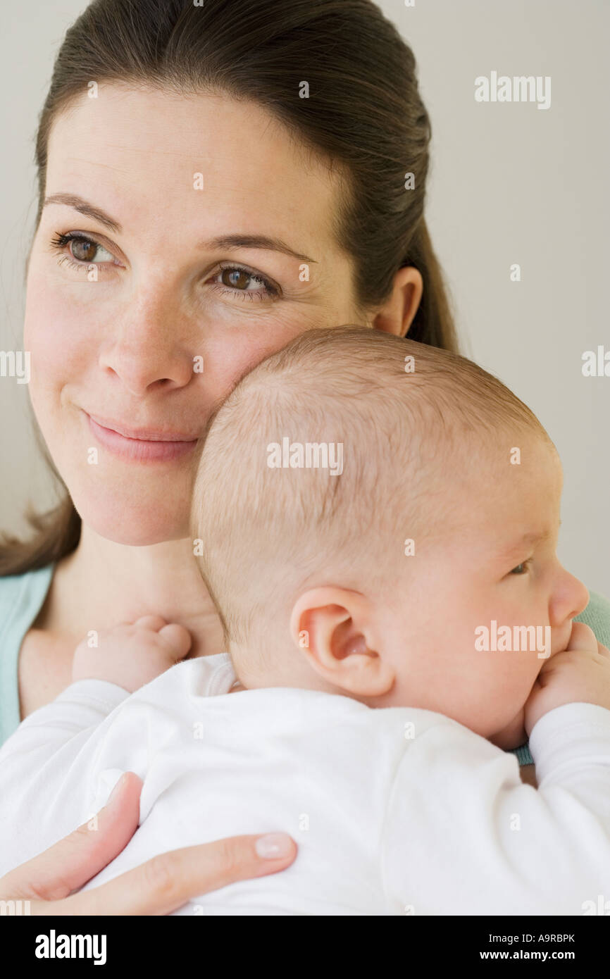Mother hugging baby Stock Photo - Alamy