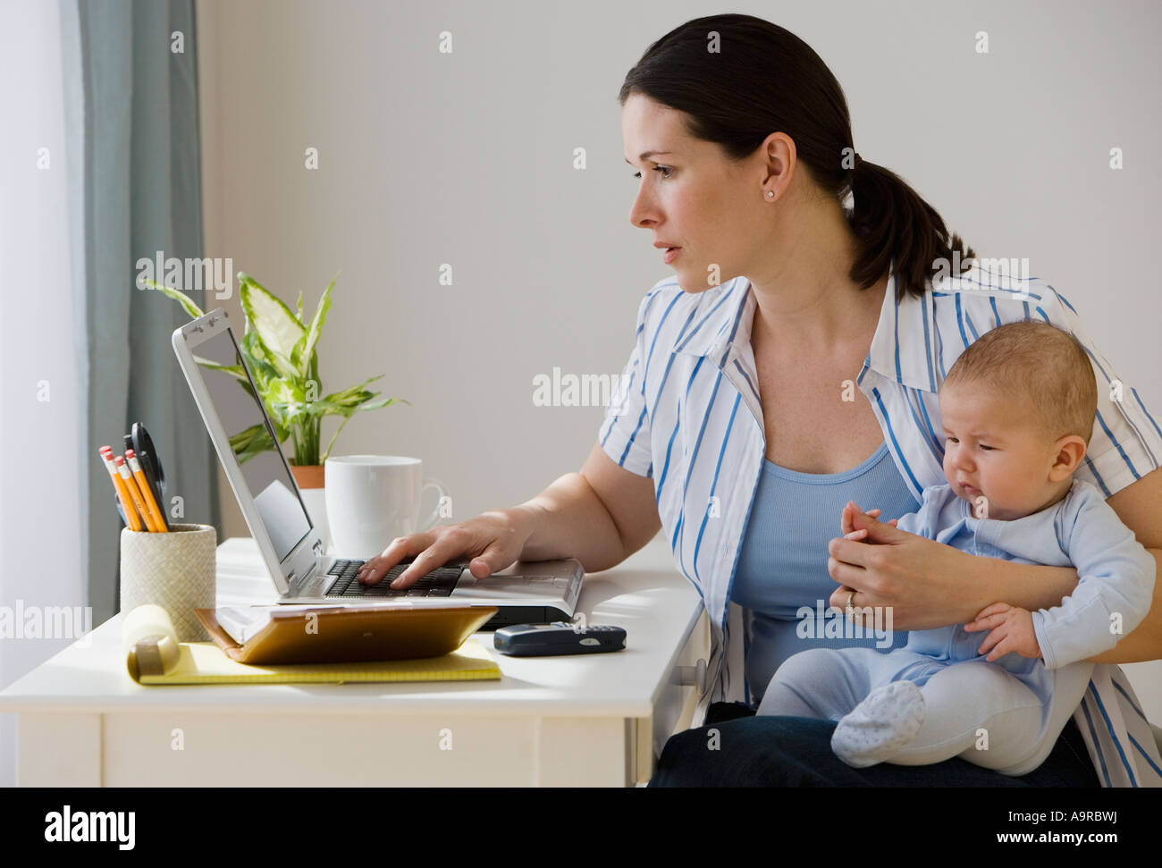Baby girl typing on pc hi-res stock photography and images - Alamy