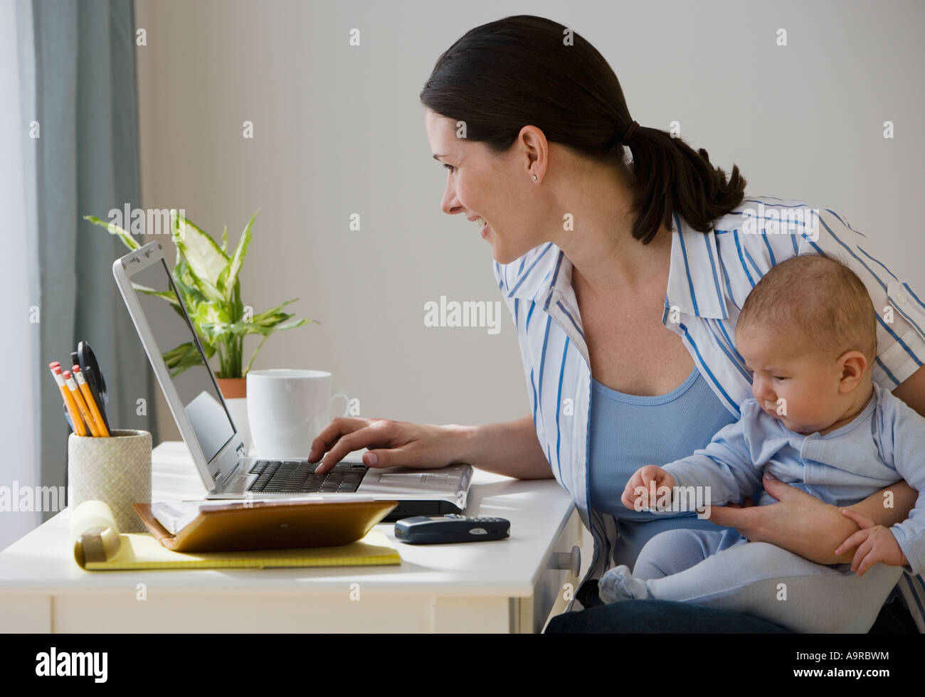 Baby girl typing on pc hi-res stock photography and images - Alamy
