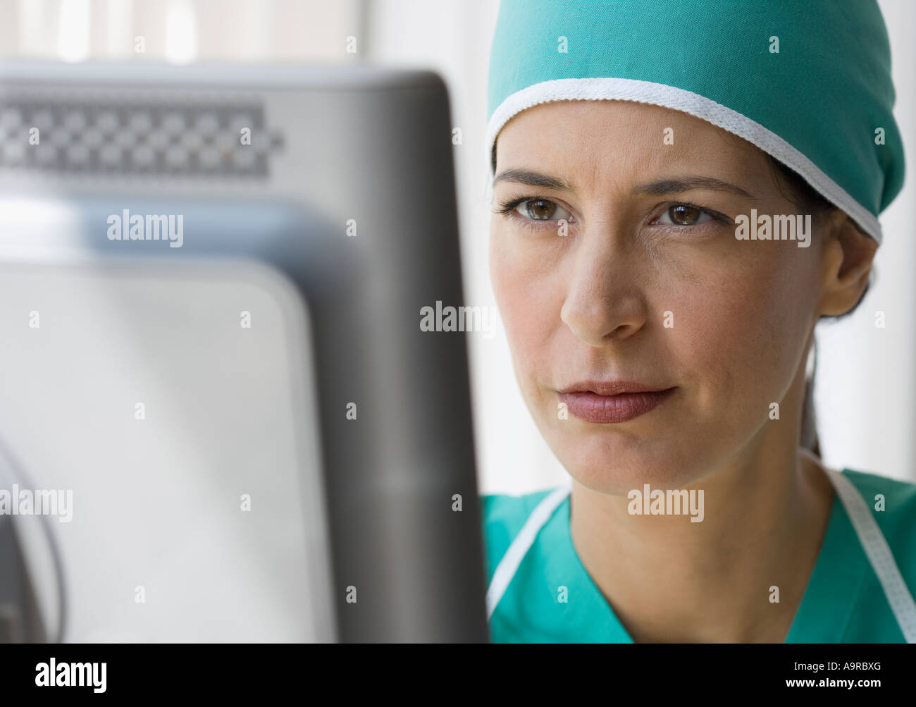 Female doctor looking at computer Stock Photo - Alamy