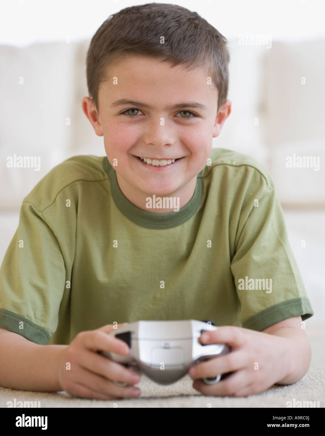 Boy holding video game controller Stock Photo - Alamy Boy holding video game controller Stock Photo - Alamy