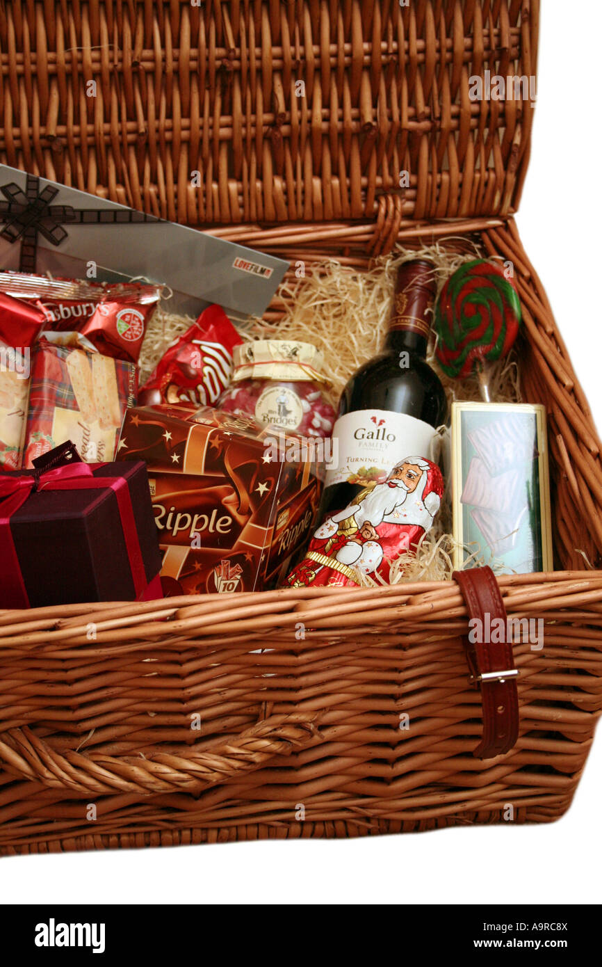 wicker hamper basket filled with gifts on white background Stock Photo ...
