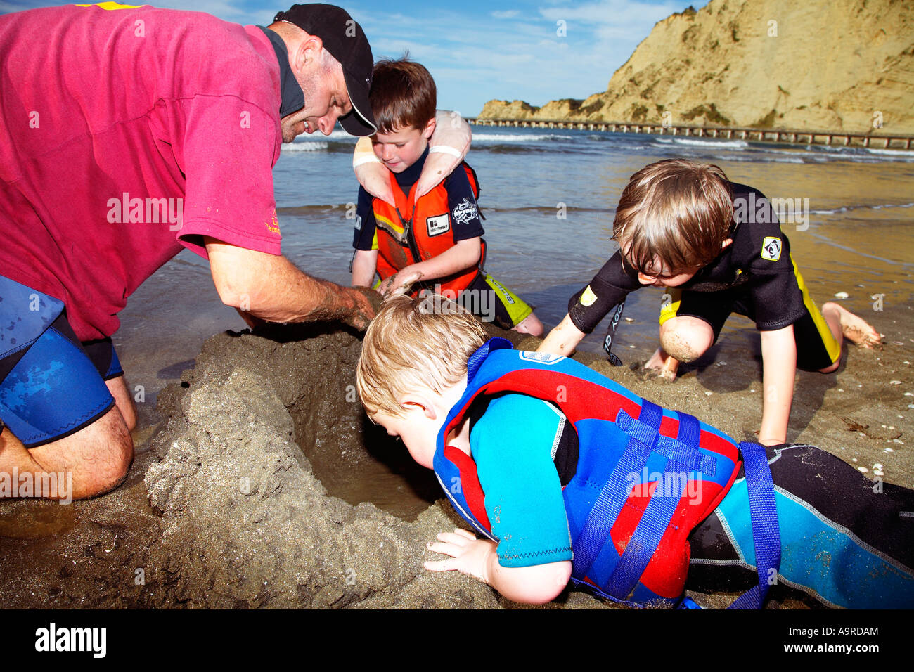 Father and son making fun at the beach hi-res stock photography and ...