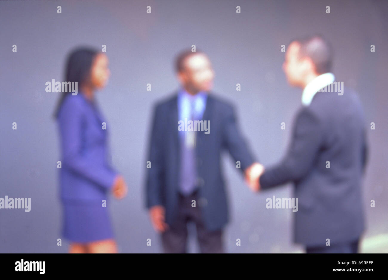 Multicultural business handshake Stock Photo - Alamy