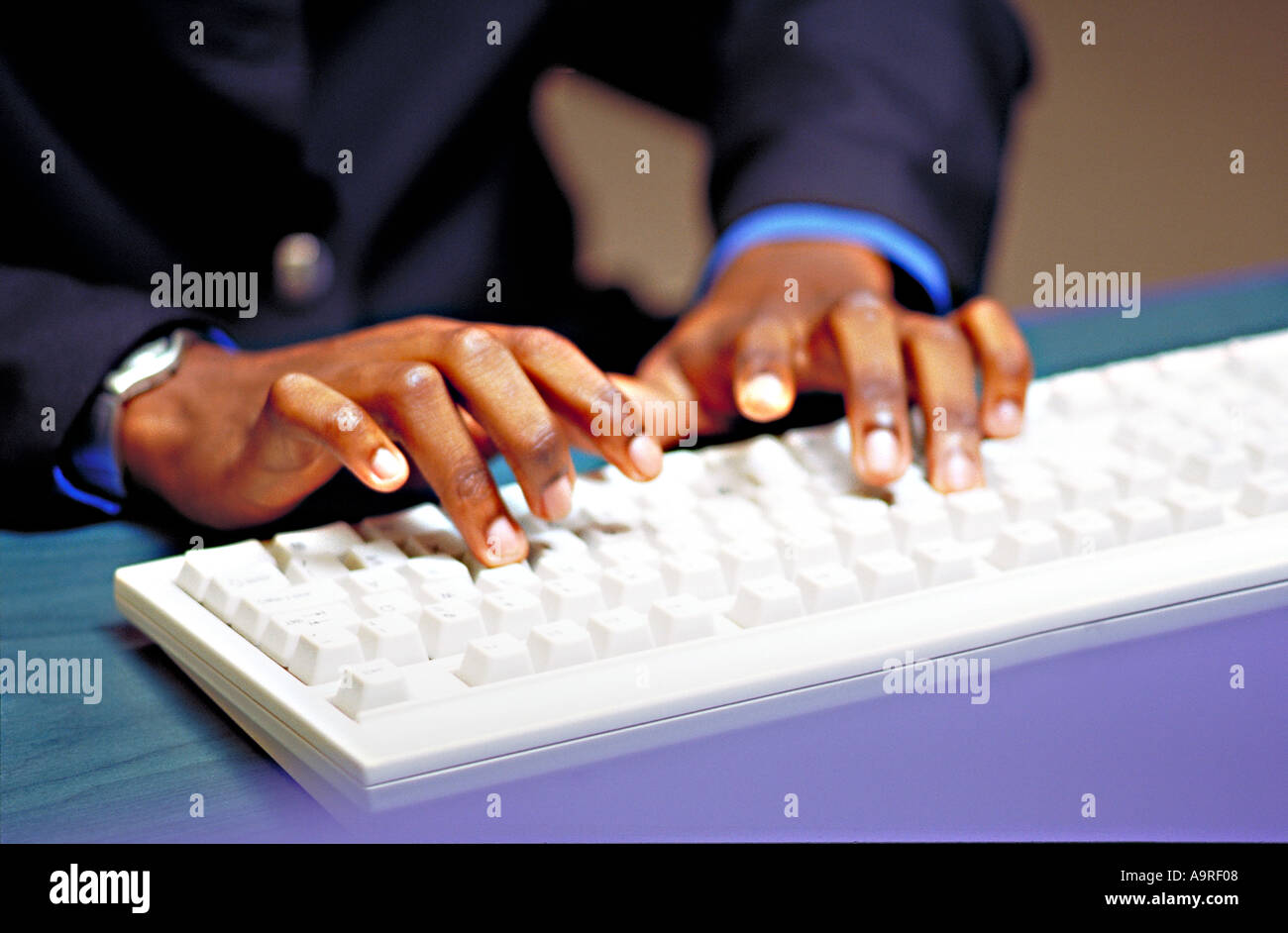 African hands typing on keyboard Stock Photo - Alamy