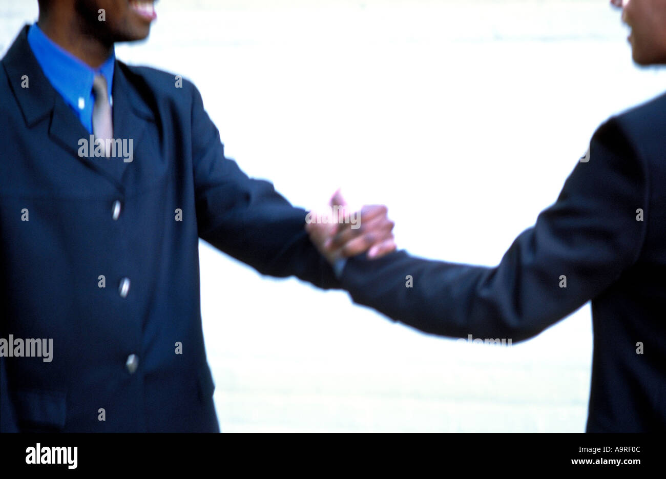 African Handshake Stock Photo - Alamy