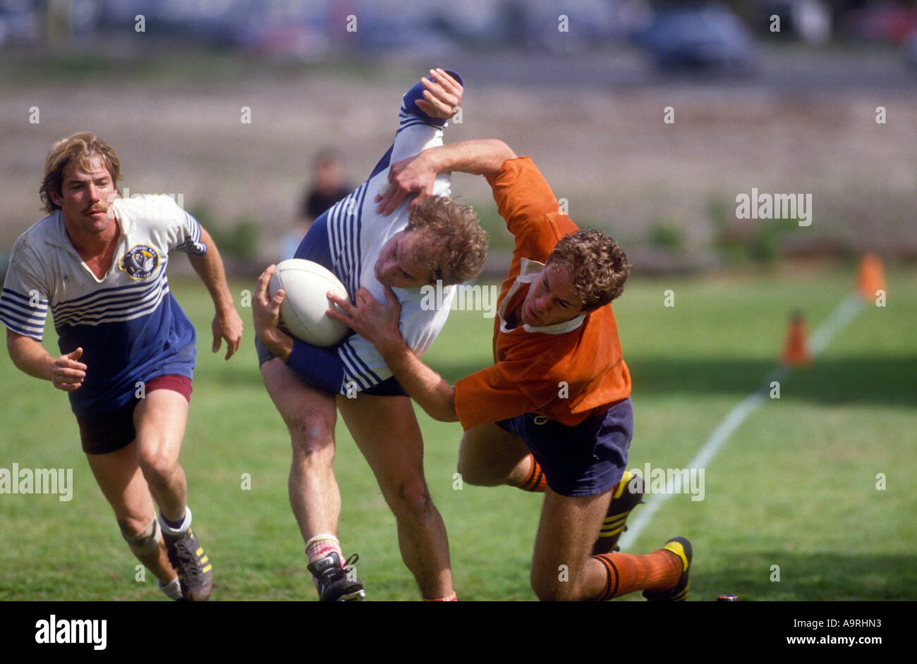 Group of male rugby players in game Stock Photo - Alamy