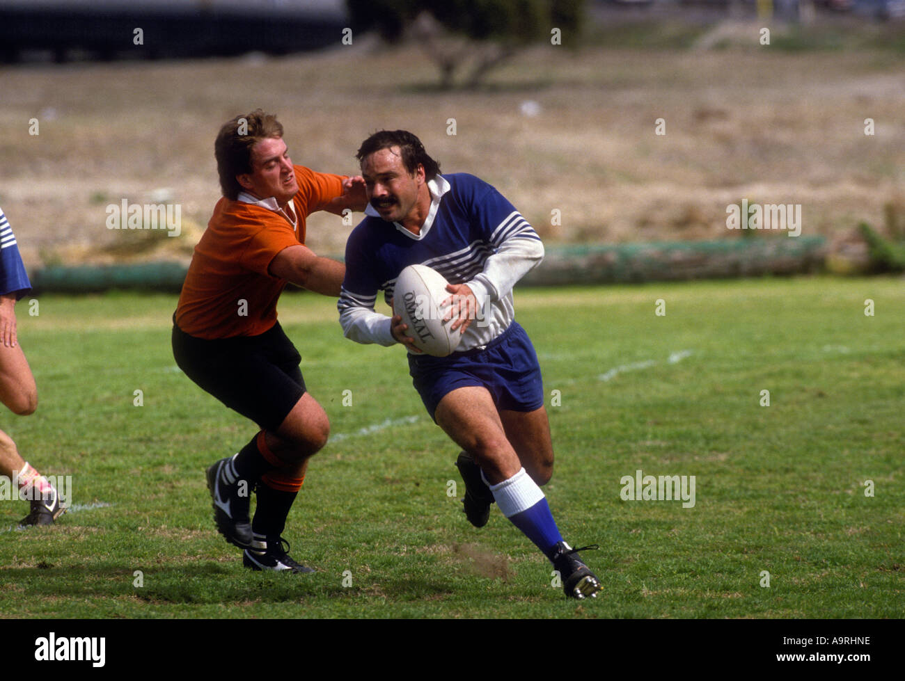 Male rugby players competing in game Stock Photo - Alamy