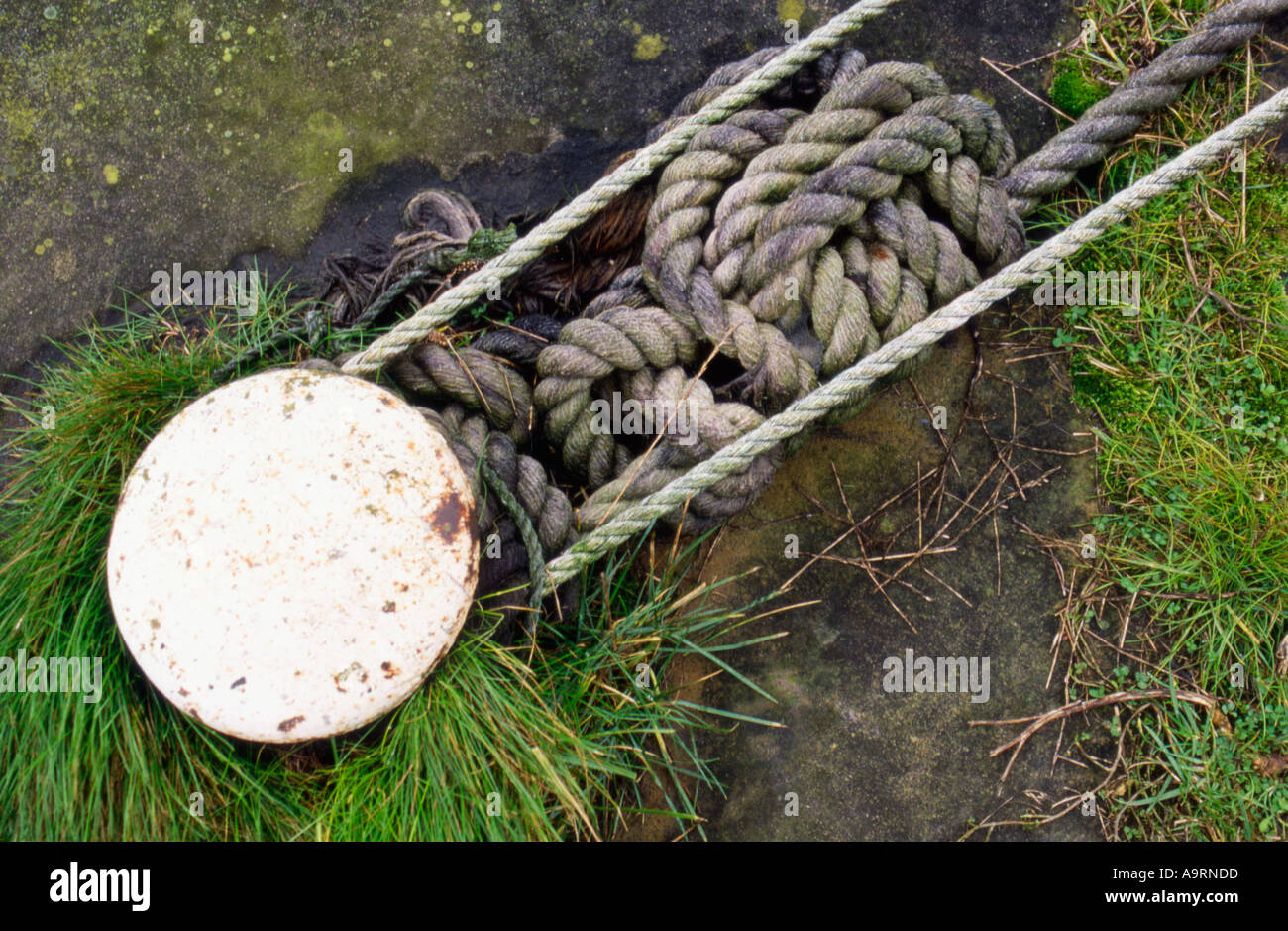 A composition using a mooring post and ropes taken at a dockside Stock ...
