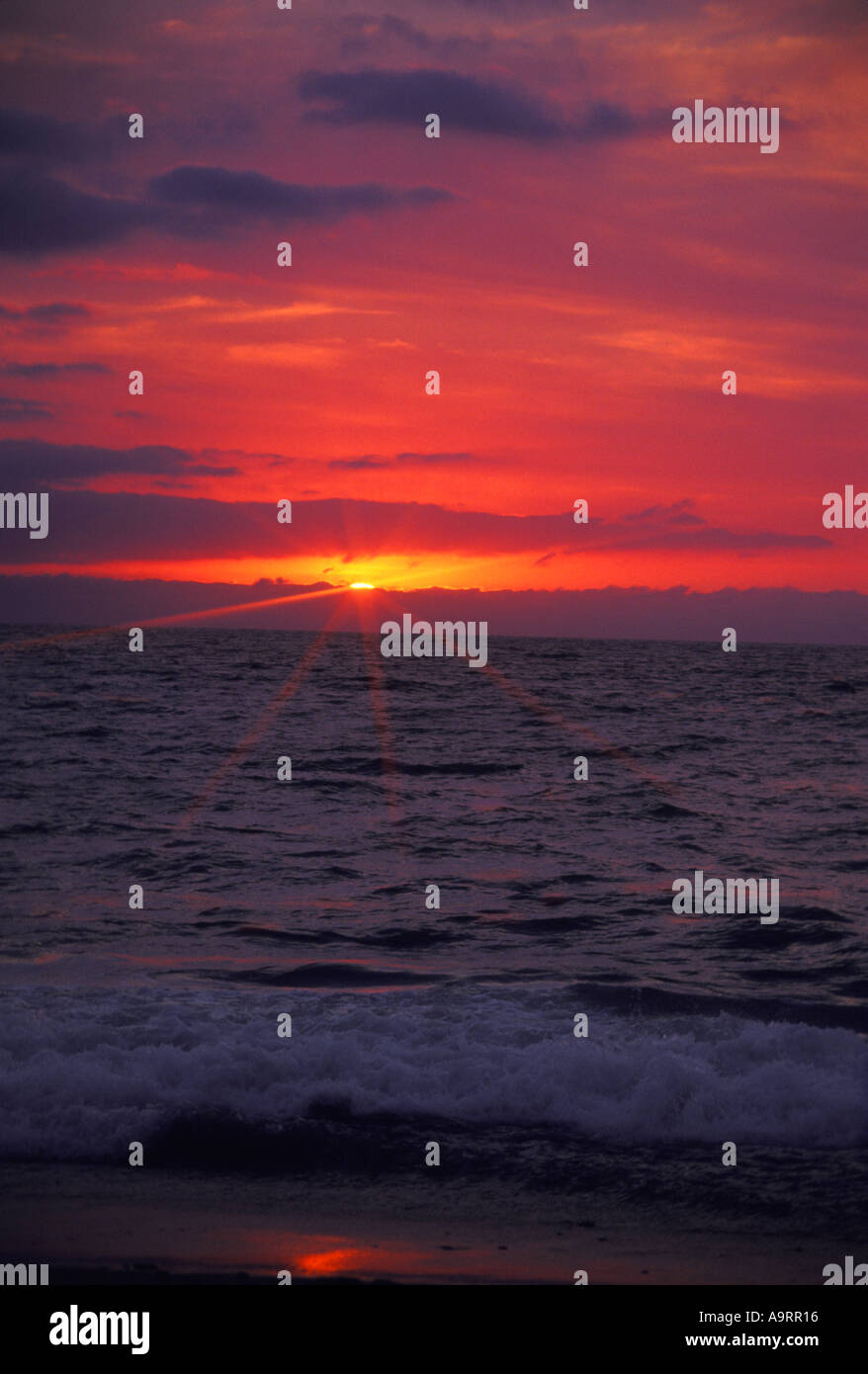 Ocean waves lighted by closing moments of sunset Stock Photo - Alamy